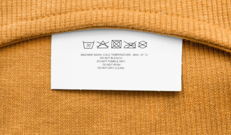 How To Read Clothing Tags: Demystifying Textile Numbers & Symbols