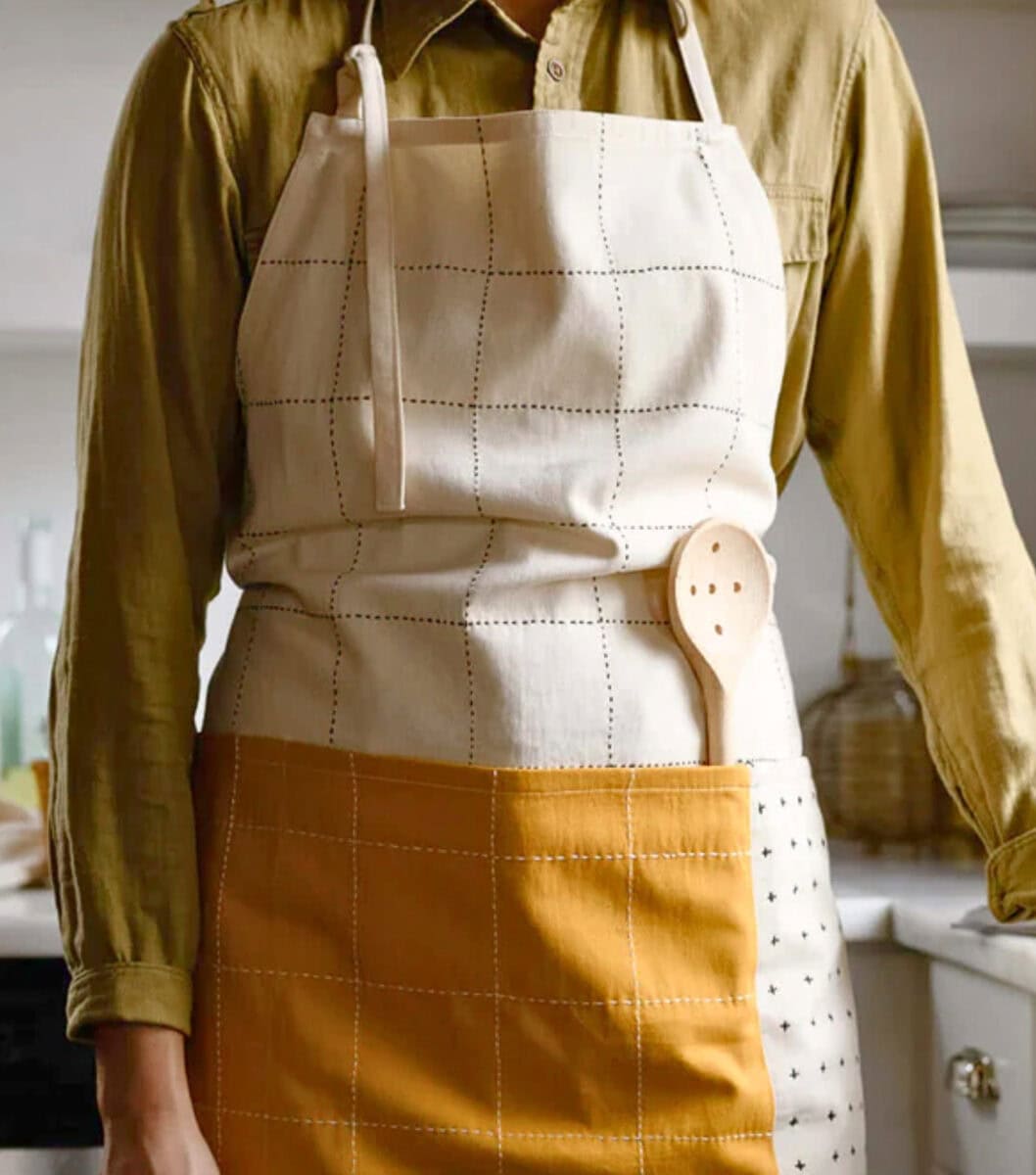 7 Sustainable Aprons To Wear For Low-Impact Cooking